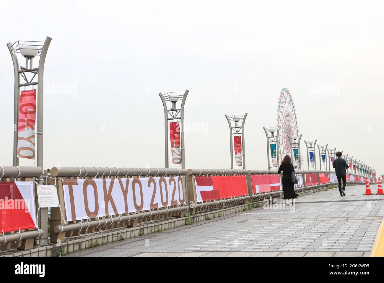 Tokyo, Japan. JULY 6, 2021 : People walk on the Yume-no-ohashi bridge ...