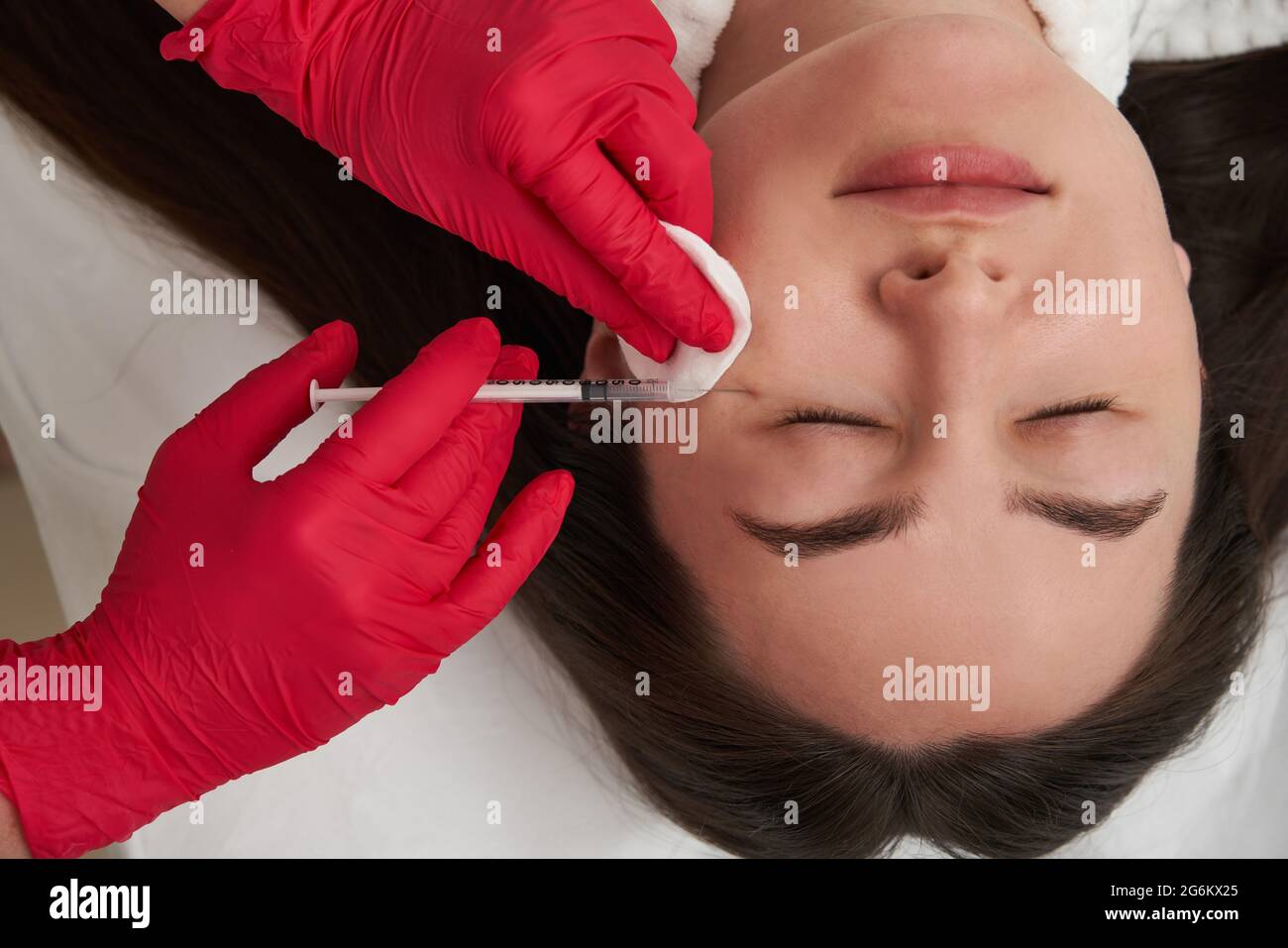Beauty injections into beautiful female face. Smoothing of mimic ...