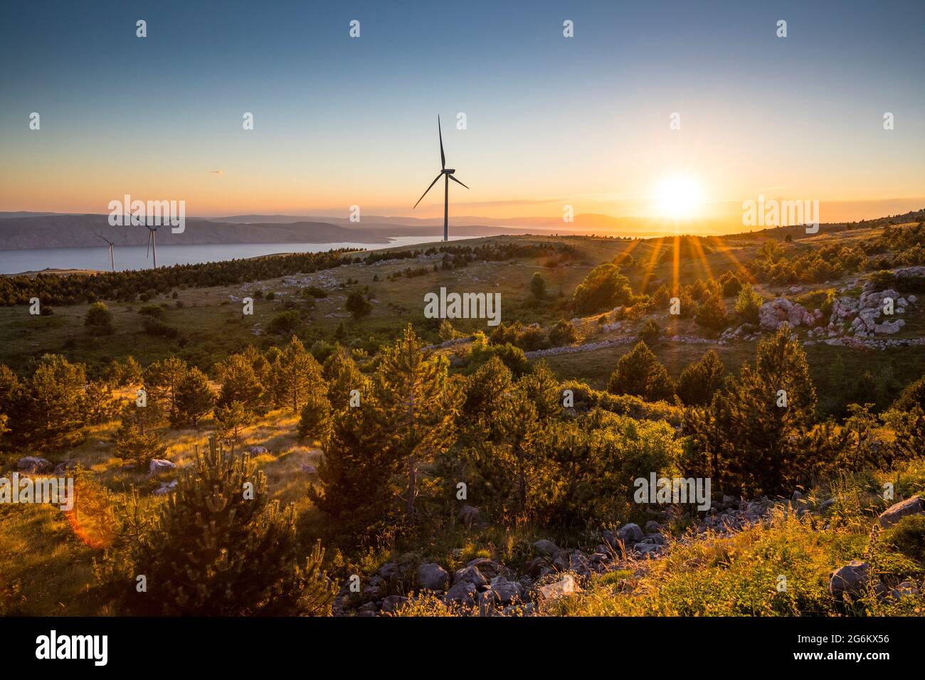 Wind turbine at sunset Stock Photo - Alamy