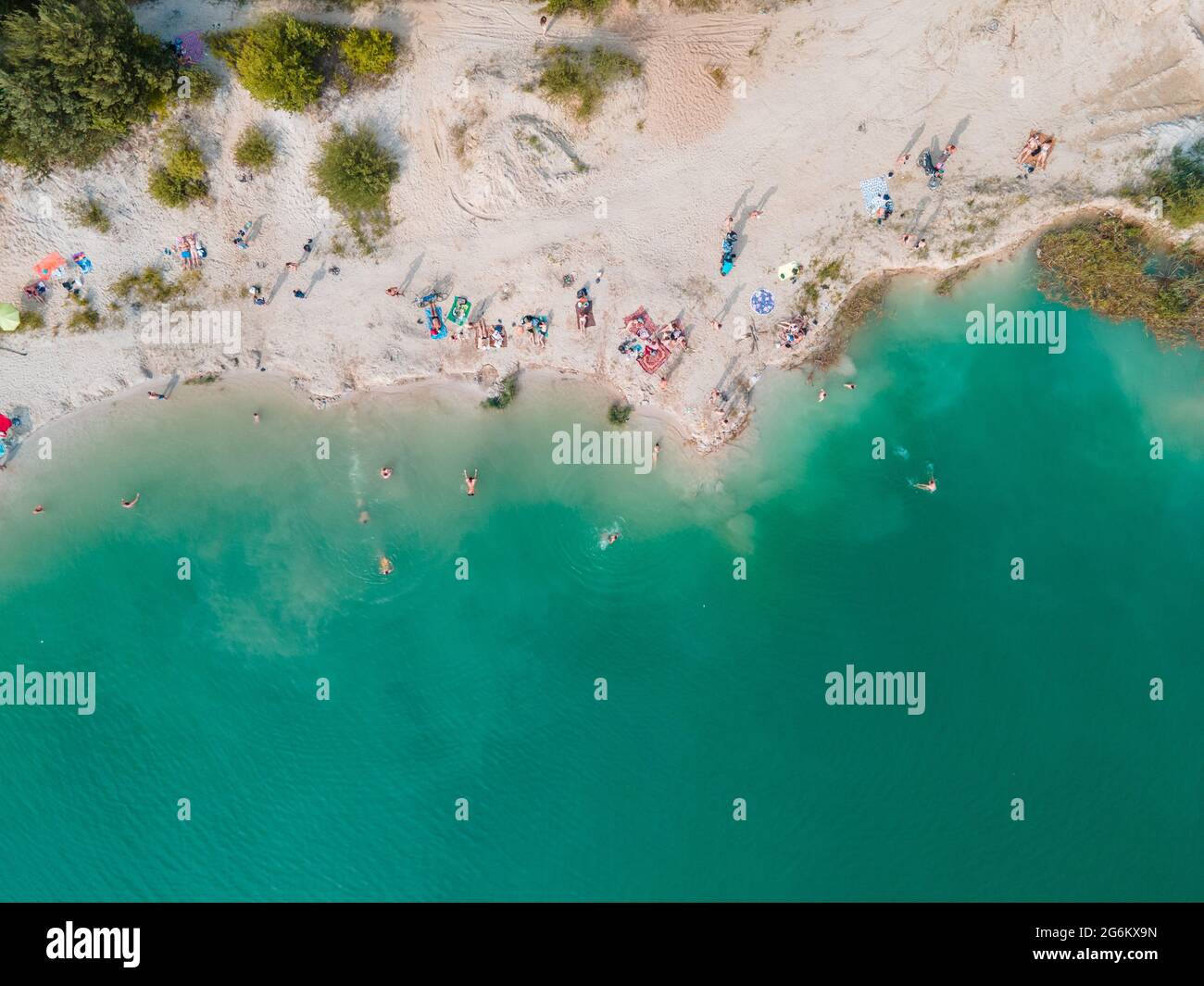 aerial view of people swimming in blue azure water sunbathing resting ...