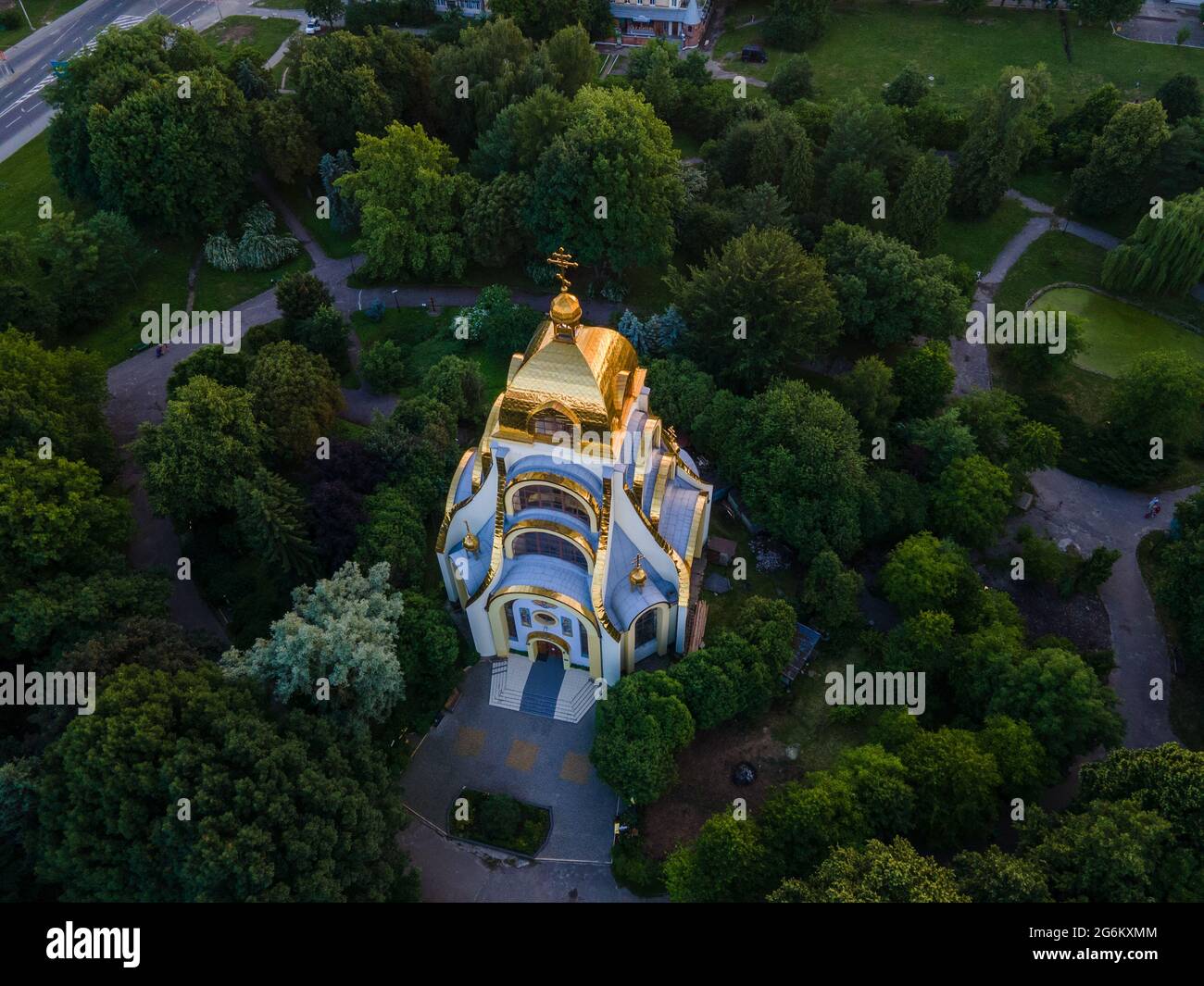 christian church with golden dome in green summer park aerial view ...