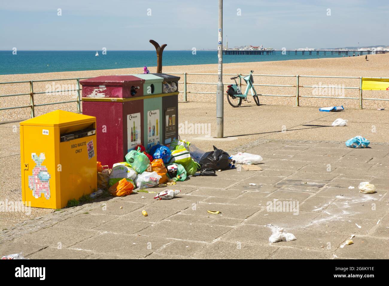 Overflowing rubbish bins with seagull damage to bags on promenade by ...