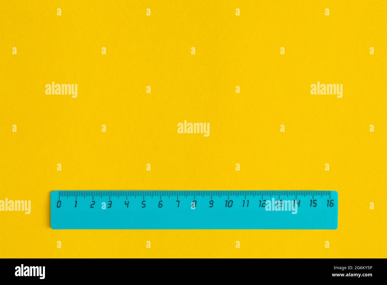 School pink ruler on yellow background. Top view with copy space. Flat ...