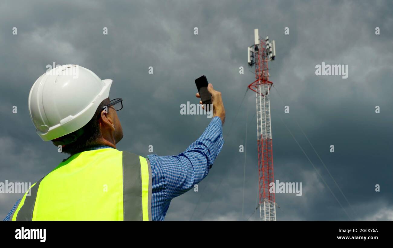 The telecommunication engineer while checking the signal with the ...