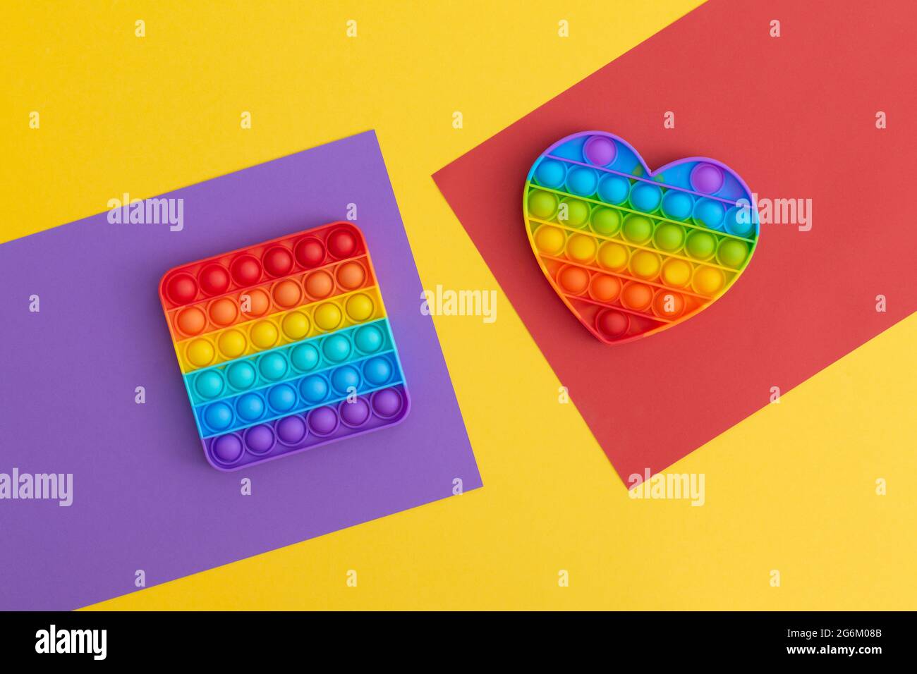 Colorful anti-stress pop it sensory toys for children on multicolored ...