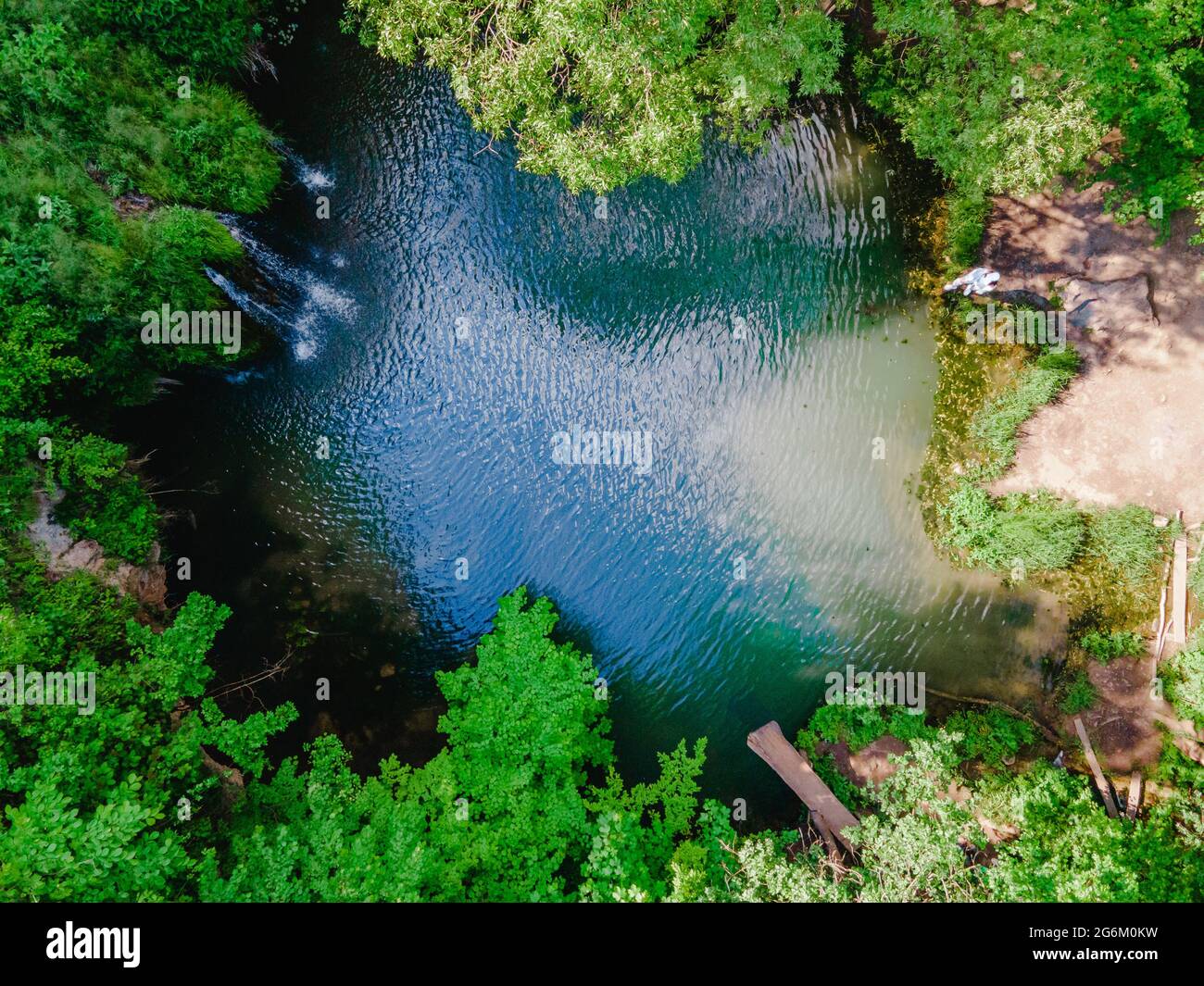 aerial view of beautiful waterfall with blue lake copy space Stock ...