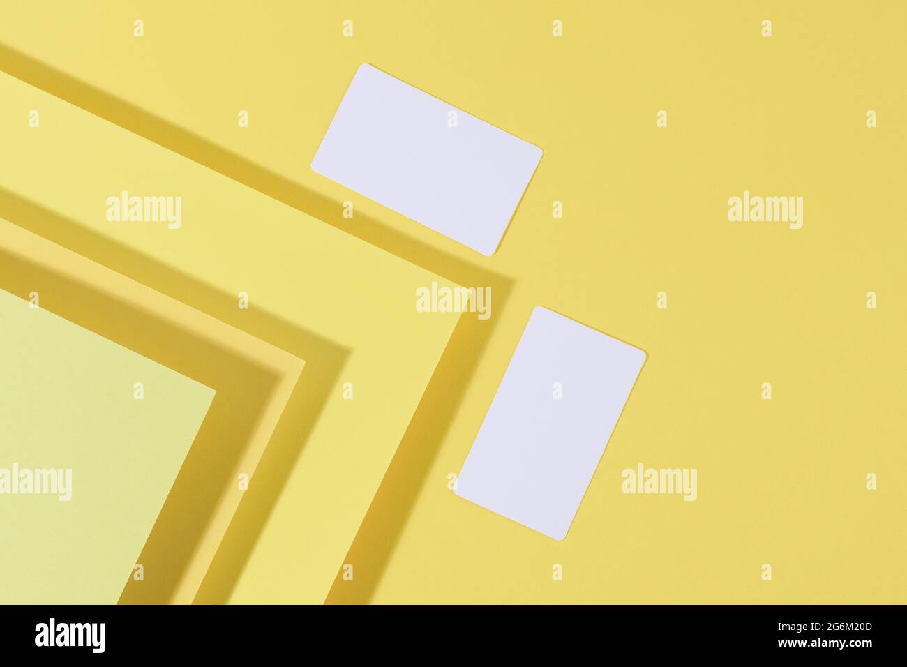 blank white rectangular business card on creative yellow background ...