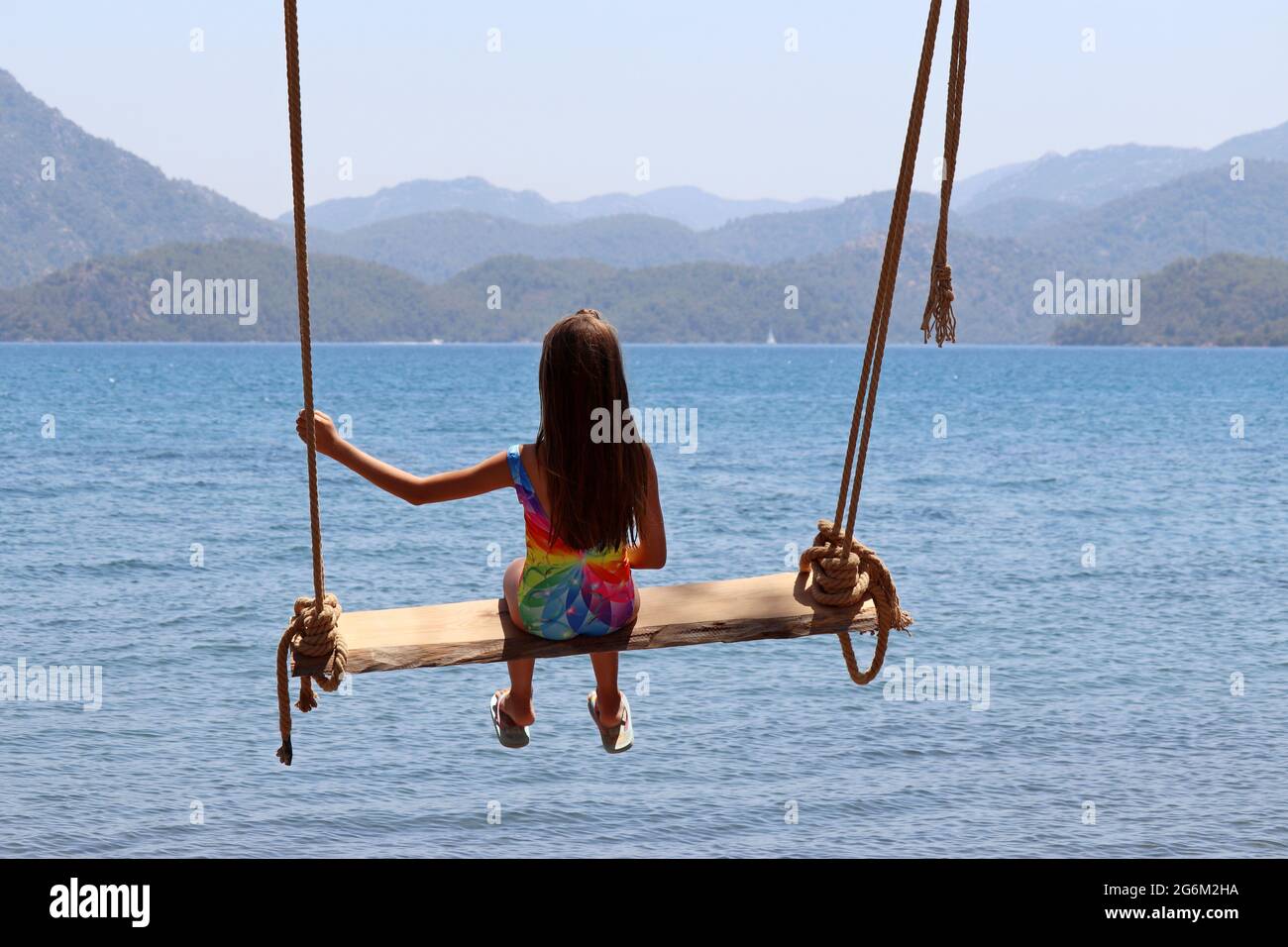 Child swinging on rope hi-res stock photography and images - Alamy