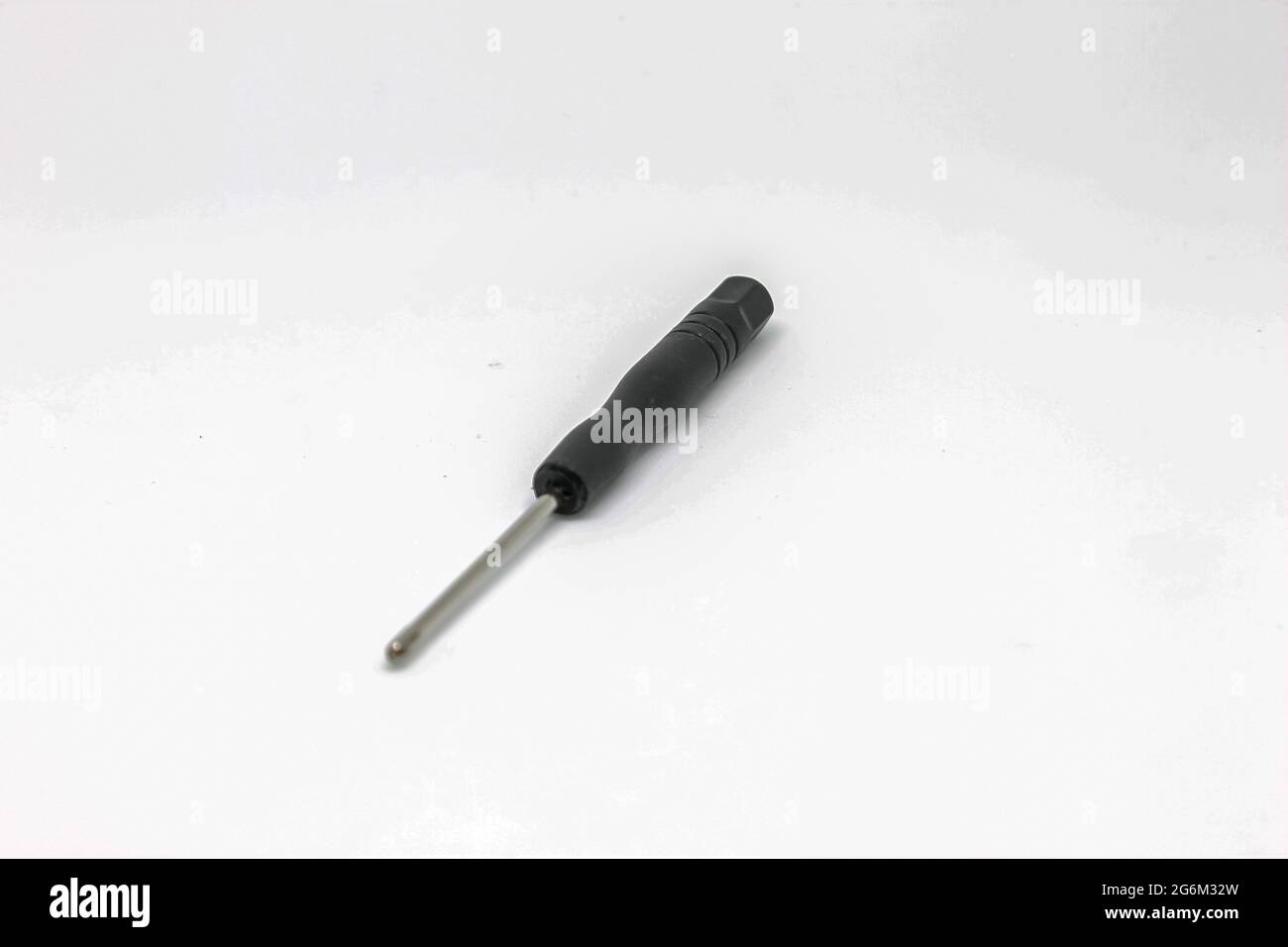 Screwdriver plus black color on a white background Stock Photo - Alamy