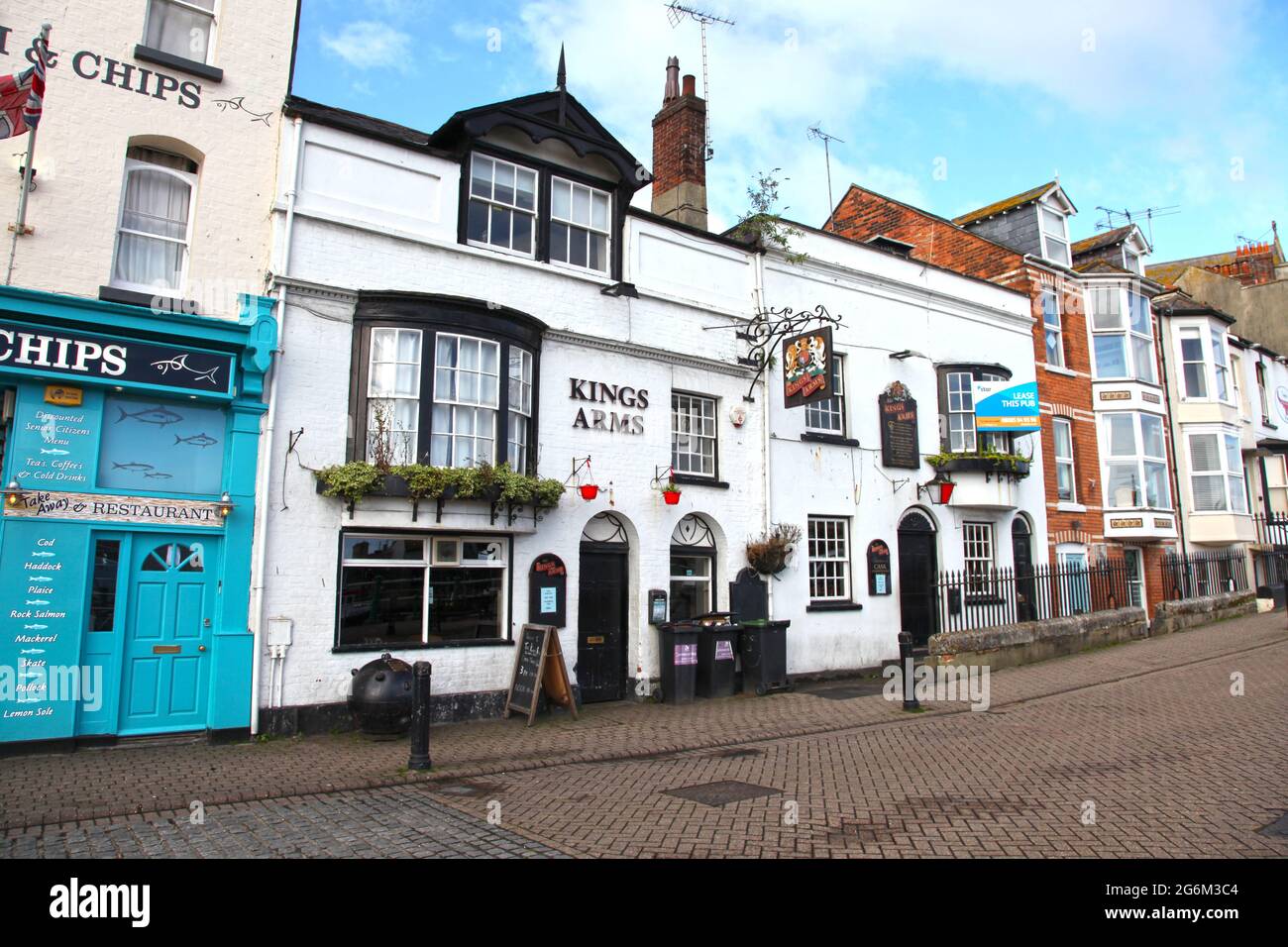 A fish and chip shop and a pub on Trinity Road in Weymouth, Dorset ...