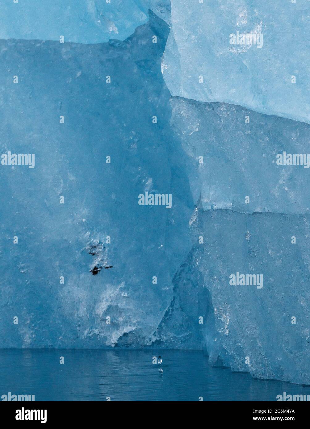 Blue iceberg in unique abstract shape. Svalbard, Spitsbergen, Norway ...