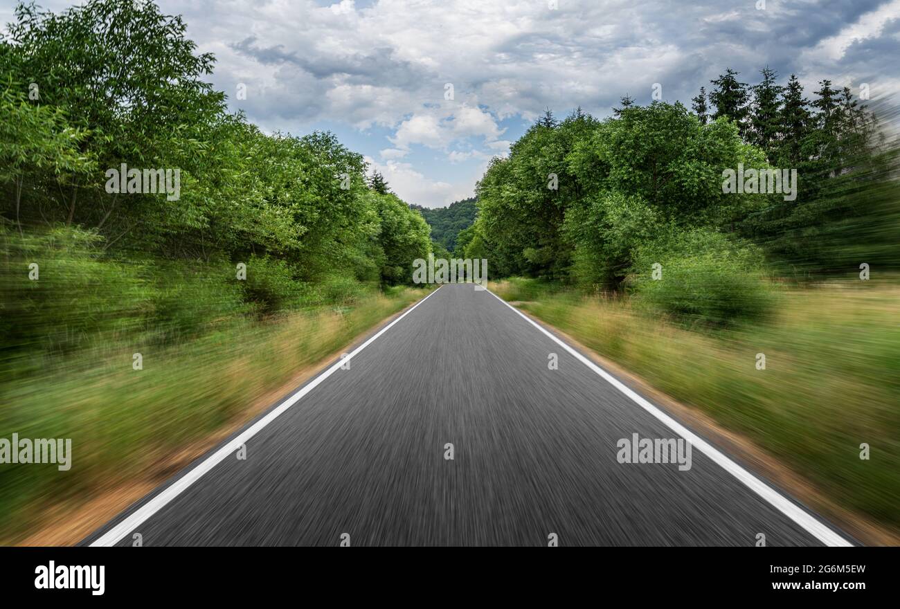 Highway among trees hi-res stock photography and images - Alamy