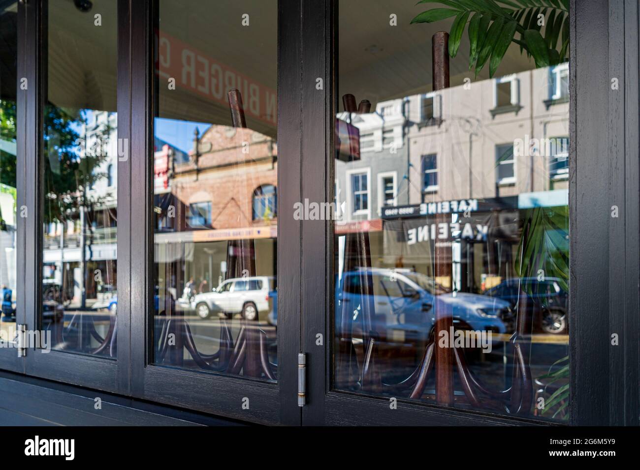 Reflections in windows of closed bar, in Balmain, Sydney Australia ...