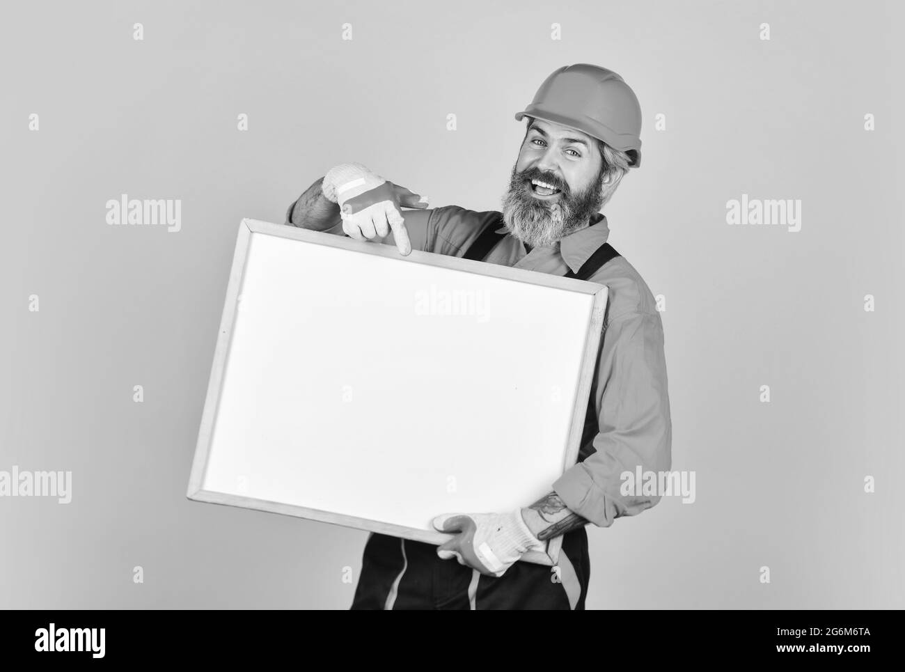 happy man with presentation. Builder points to flipchart. Architect ...