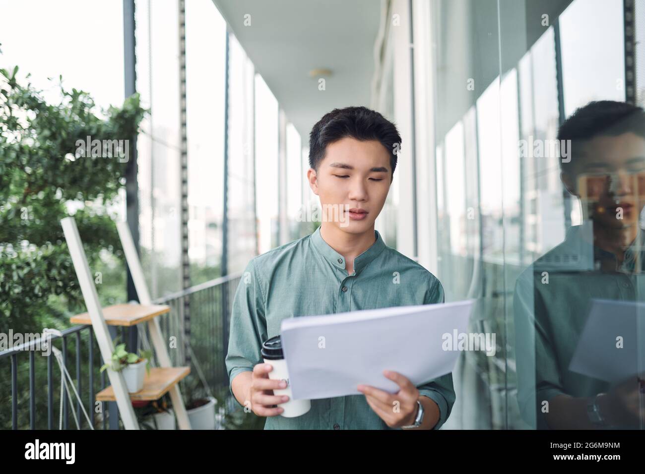 Male professional holding documents hi-res stock photography and images ...