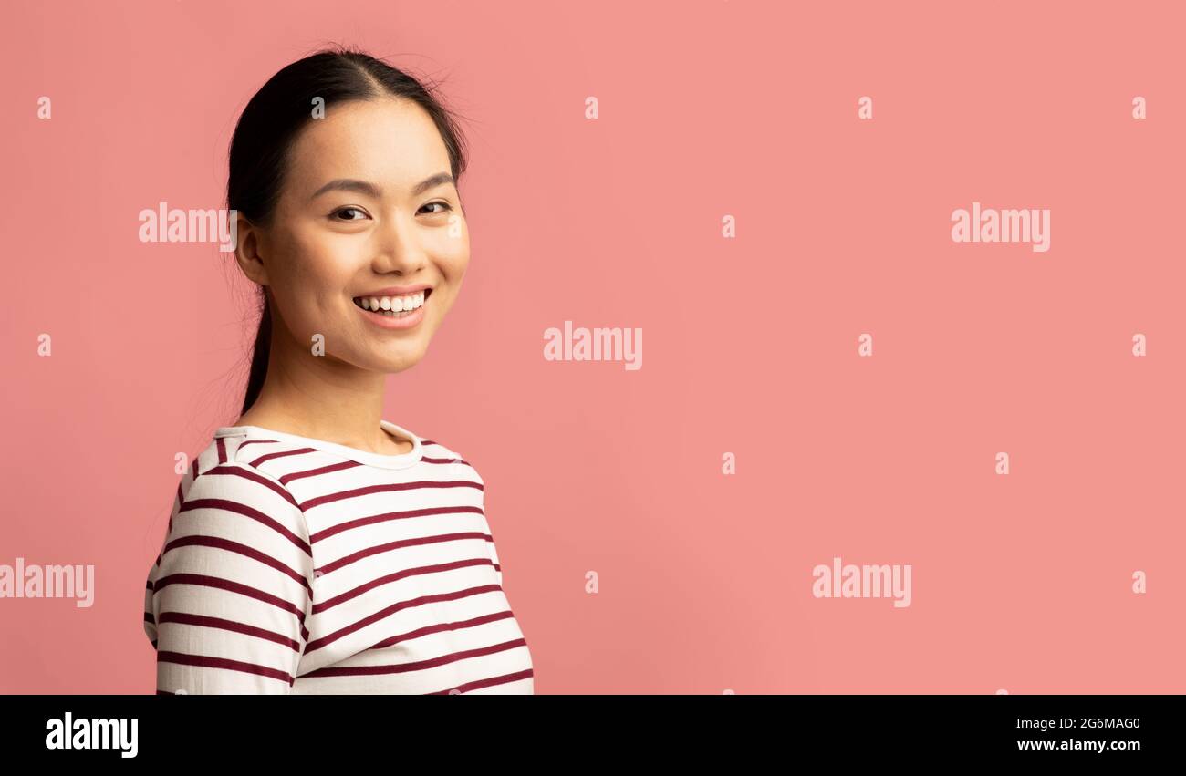 Portrait Of Beautiful Millennial Asian Woman Posing Over Pink ...