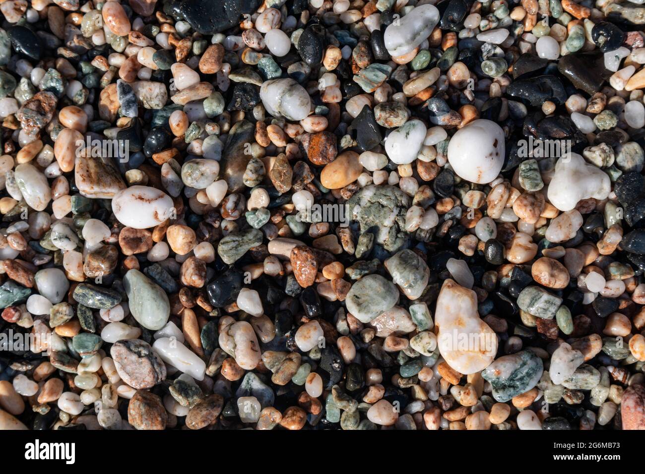 Aegean sea pebble marble stone beach close-up texture. Various rocky ...