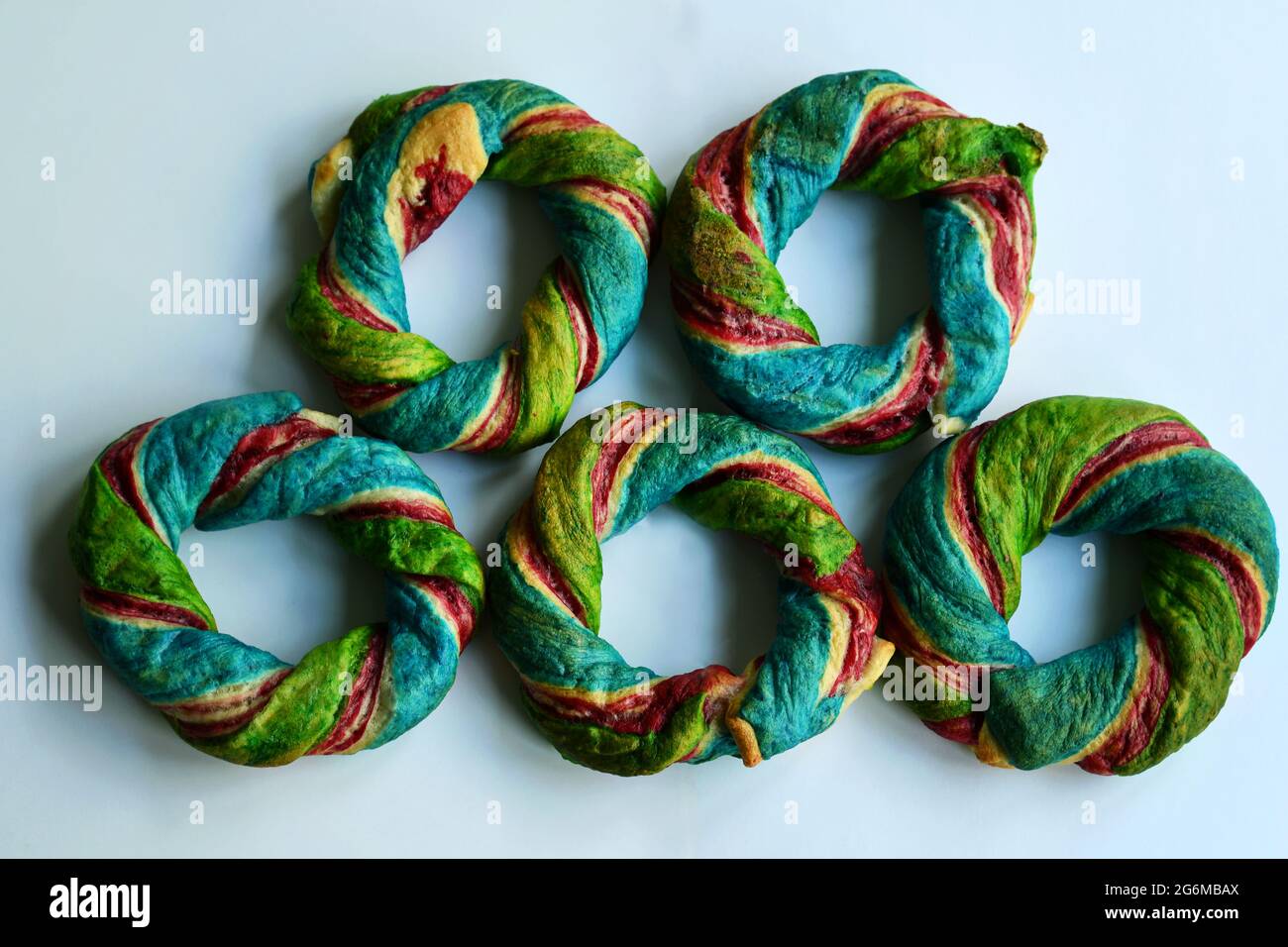 Baked bagels in rainbow colors. Happy colorful breakfast bread Stock ...