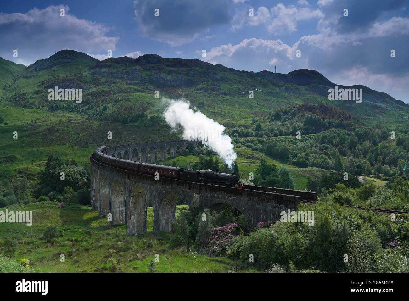 Harry potter jacobite train crossing the glenfinnan viaduct Stock Photo ...