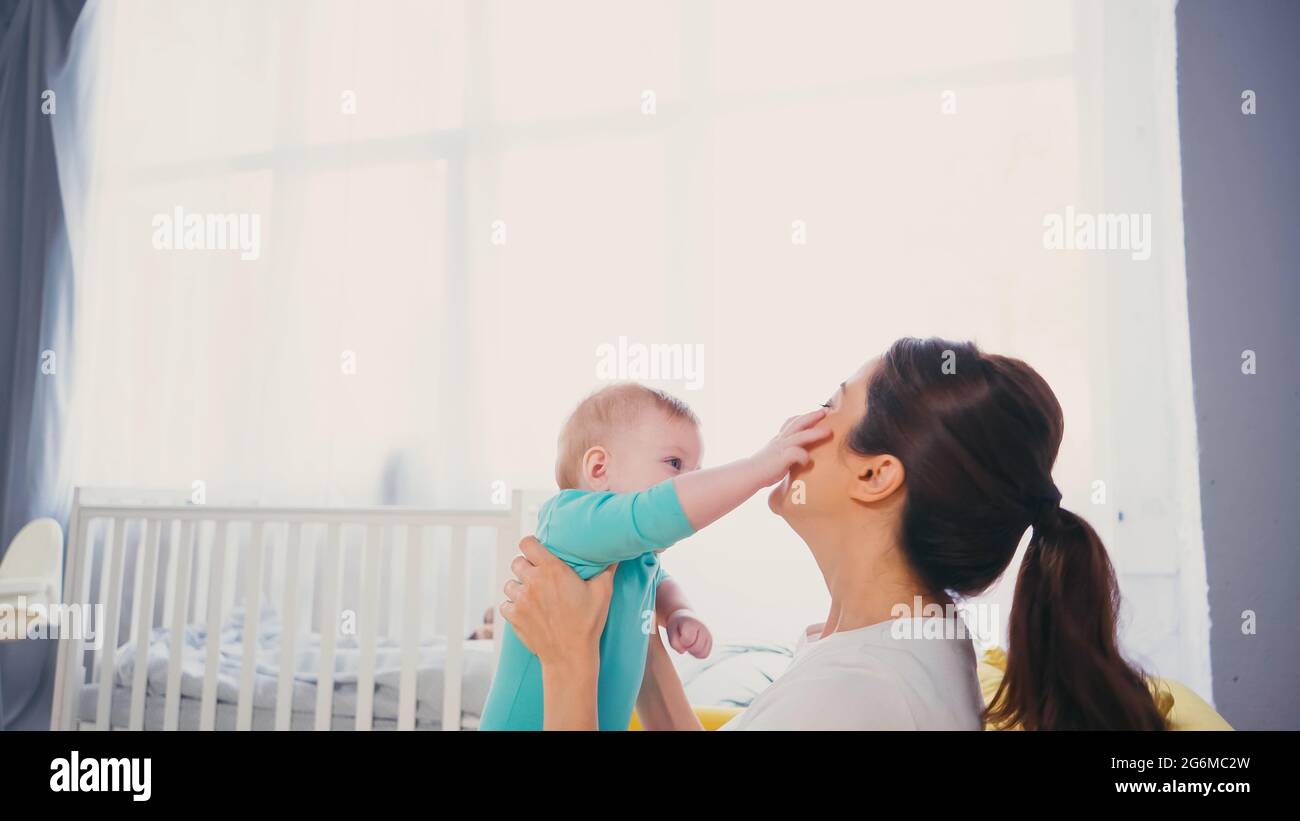 Baby and reaching arms hi-res stock photography and images - Alamy
