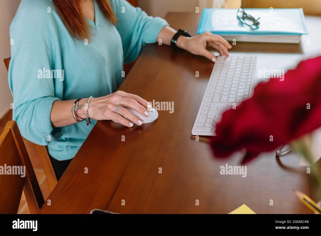 Adult woman teleworking from home Stock Photo - Alamy