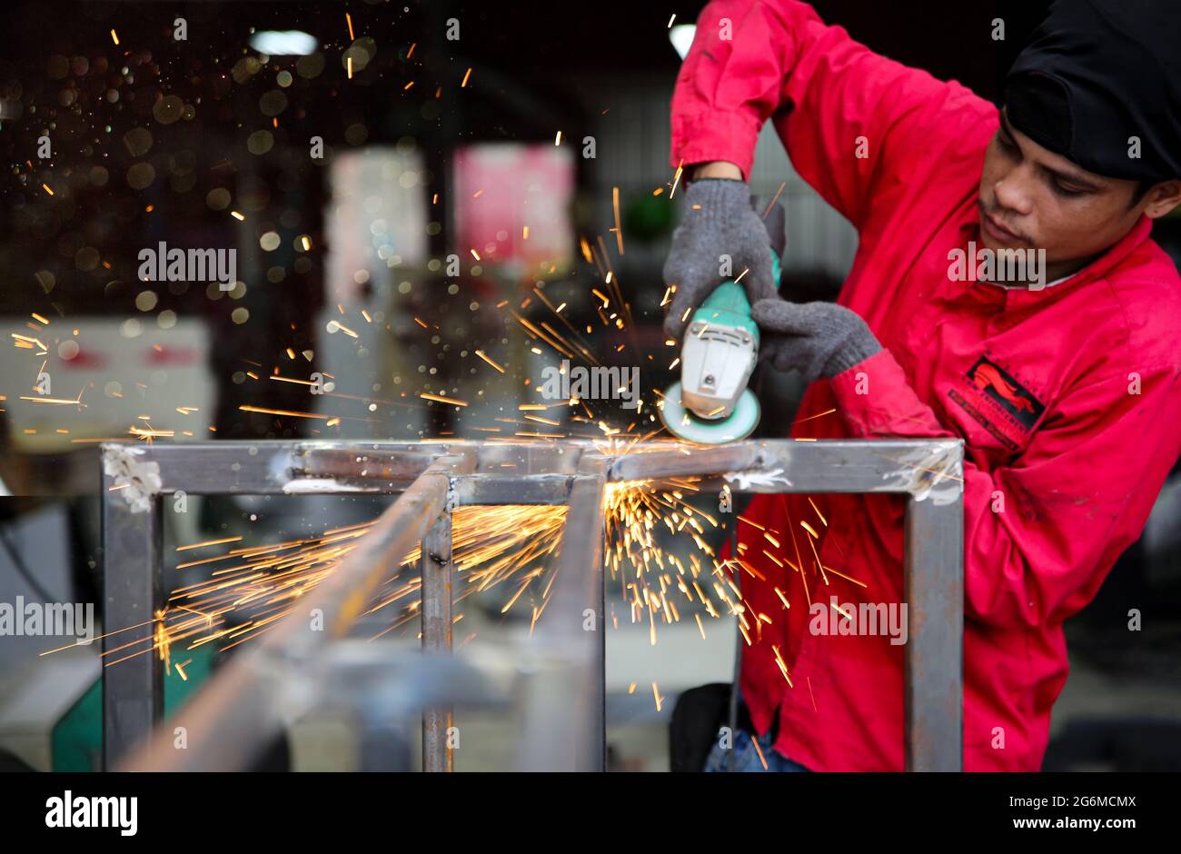 Welder used grinding stone on steel in factory with sparks, Welding ...
