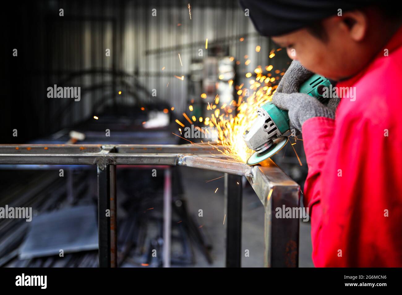 Welder used grinding stone on steel in factory with sparks, Welding ...