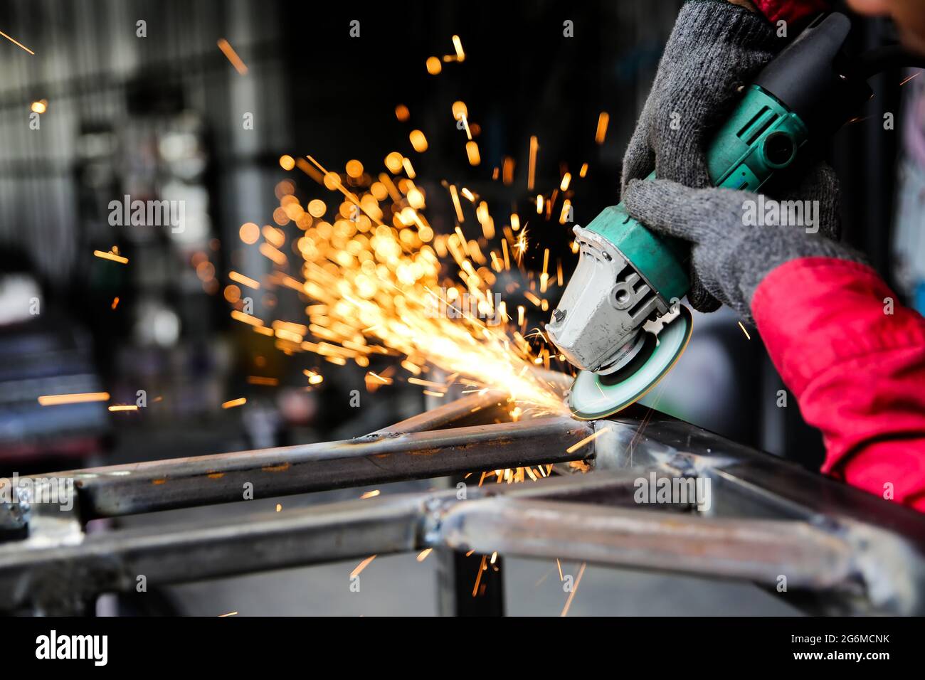 Welder used grinding stone on steel in factory with sparks, Welding ...