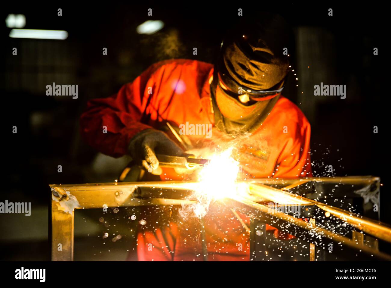 Welder used grinding stone on steel in factory with sparks, Welding ...