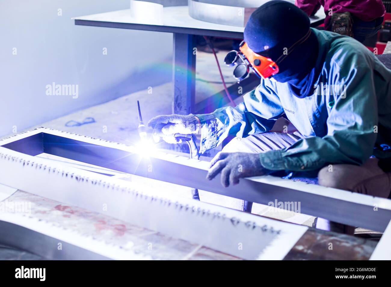 Welder used grinding stone on steel in factory with sparks, Welding ...