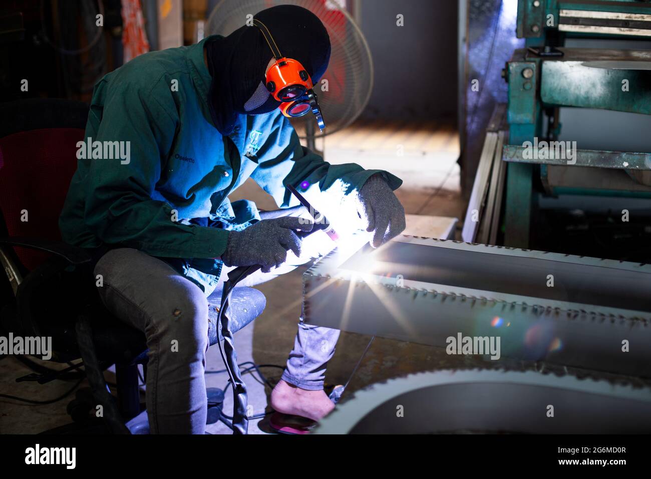 Welder used grinding stone on steel in factory with sparks, Welding ...