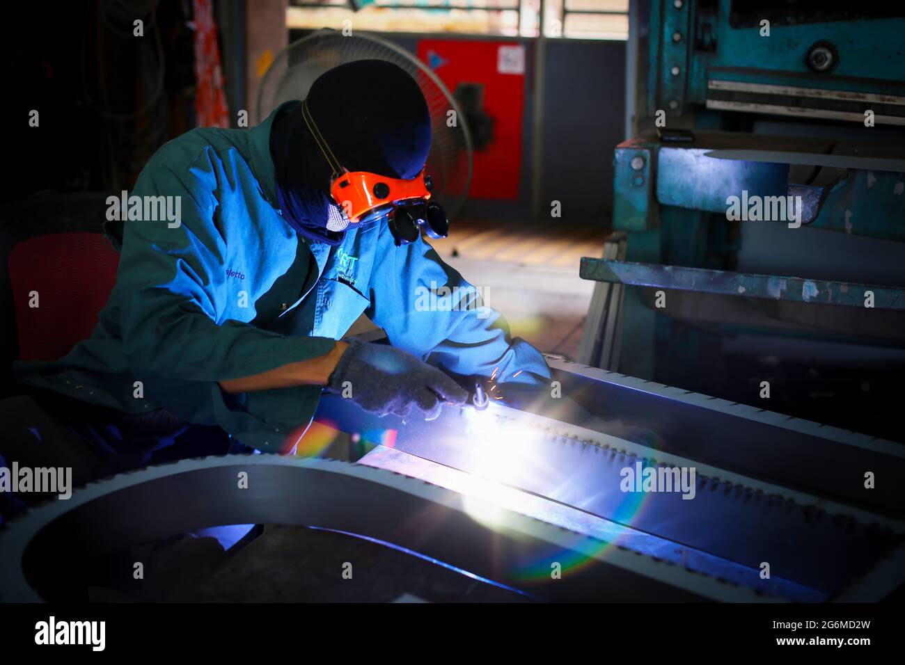 Welder used grinding stone on steel in factory with sparks, Welding ...