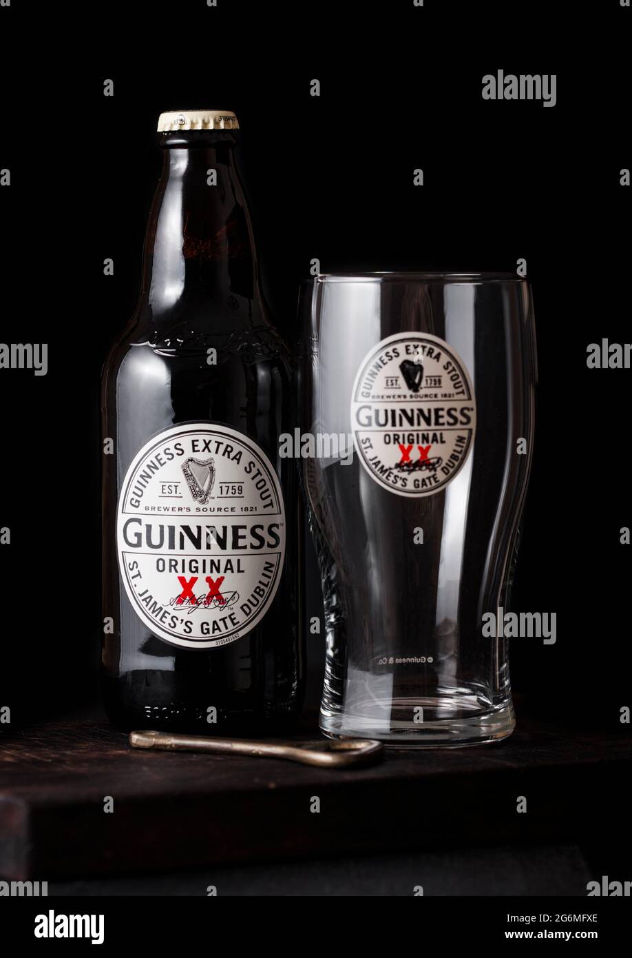 LONDON, UK - APRIL 27, 2018: Original glass and bottle of Guinness ...