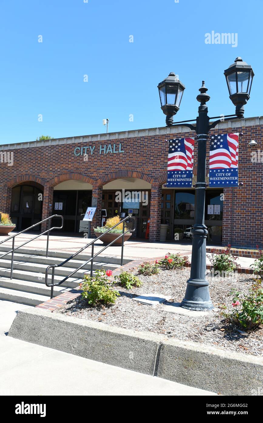 WESTMINSTER, CALIFORNIA - 5 JULY 2021: Lamppost with banners in front ...