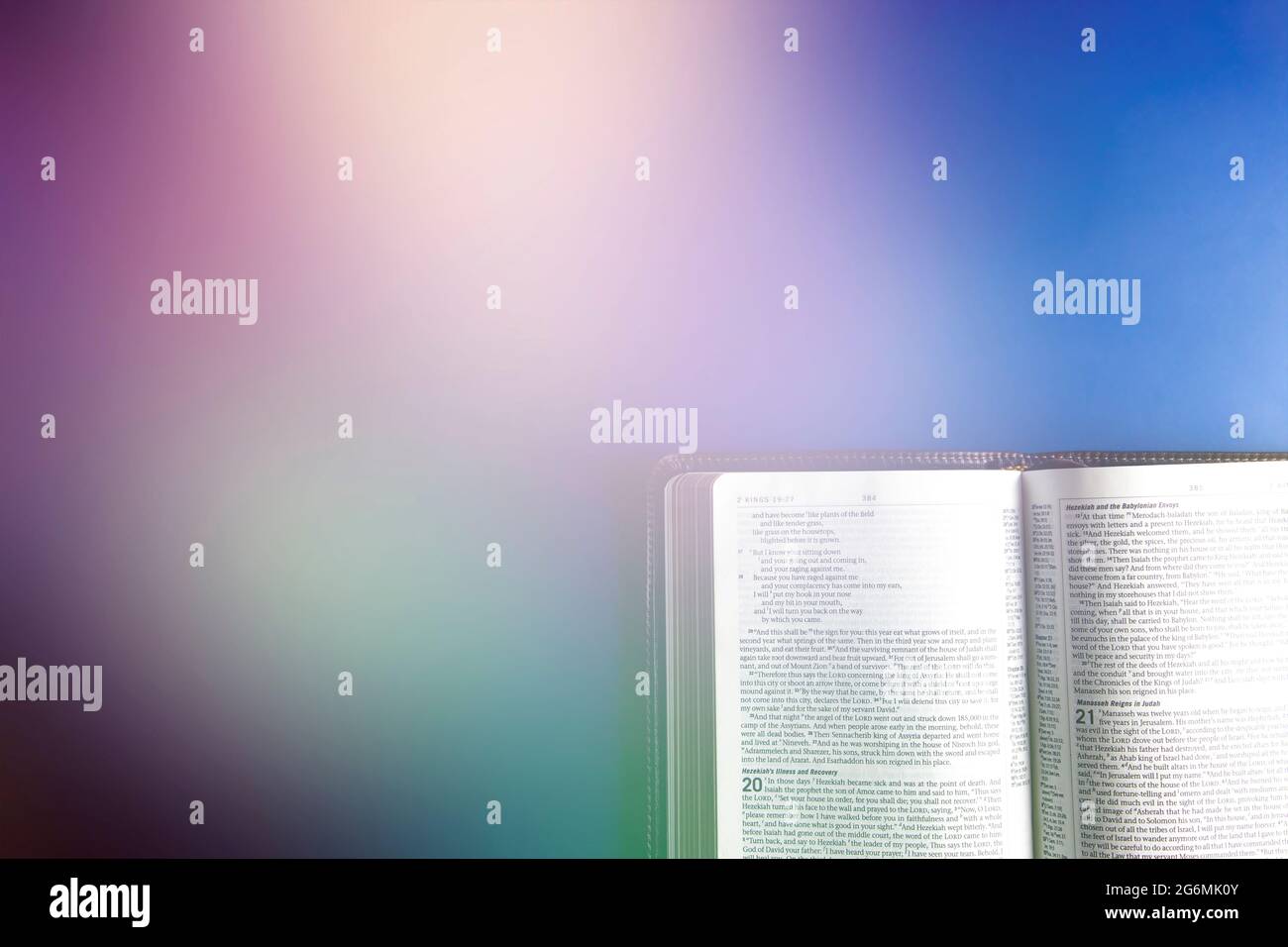 A Single Bible Open on an a Blue Background Stock Photo - Alamy
