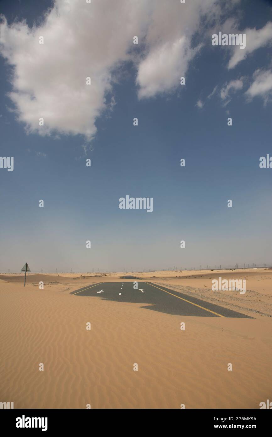 Sand covering the road in Dubai, UAE Stock Photo - Alamy