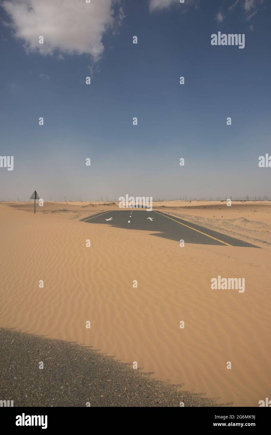 Sand covering the road in Dubai, UAE Stock Photo - Alamy