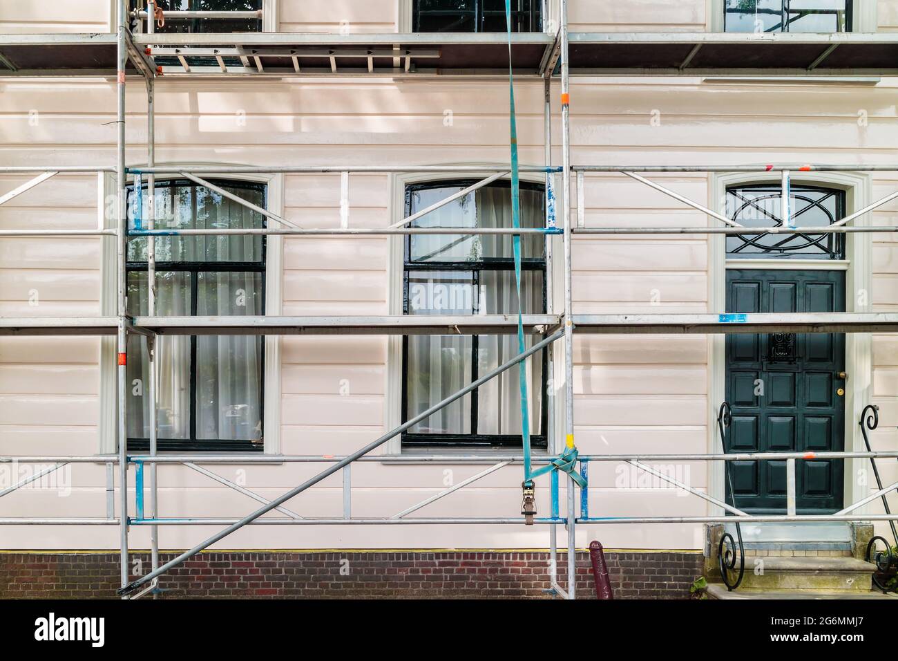 Restoration and painting of an ancient Dutch wooden house in North ...