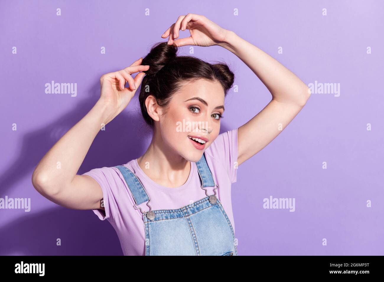 Photo of charming pretty young woman dressed denim overall looking ...