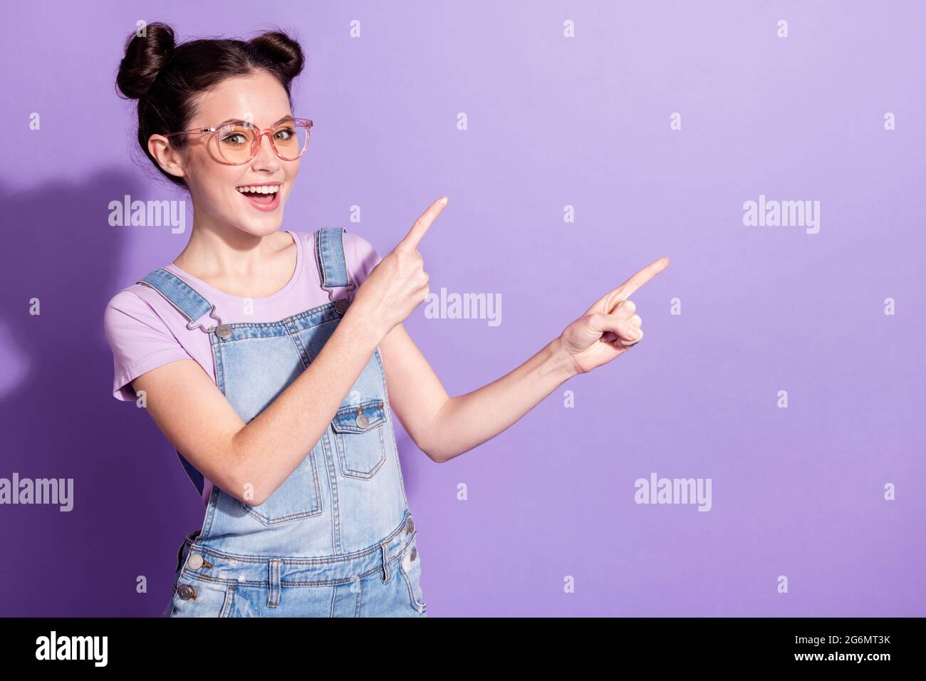 Photo of young girl happy positive smile point fingers empty space ad ...