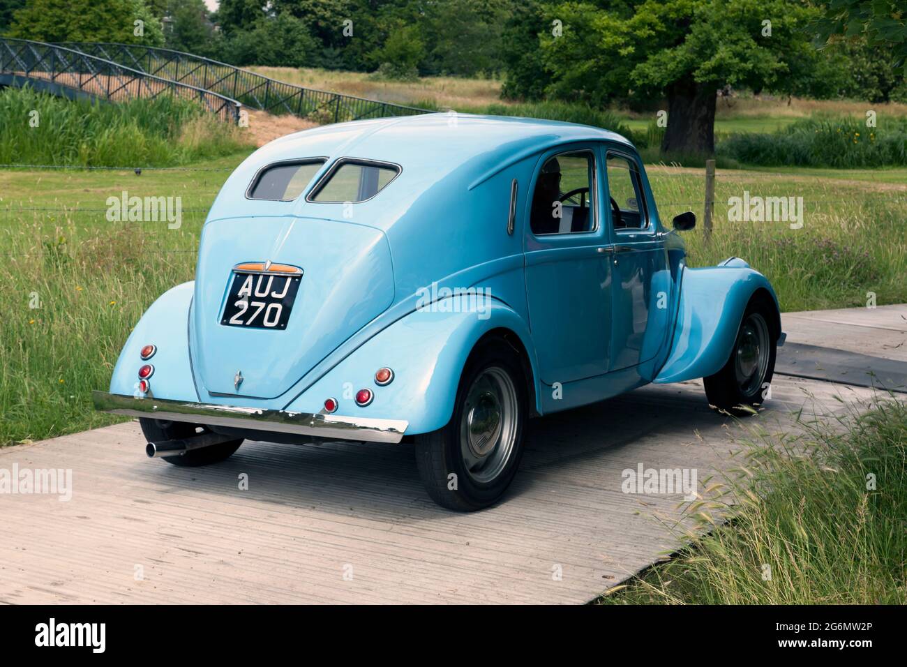 Three-quarters rear view of a Blue, 1938, Lancia Aprilia, being ...
