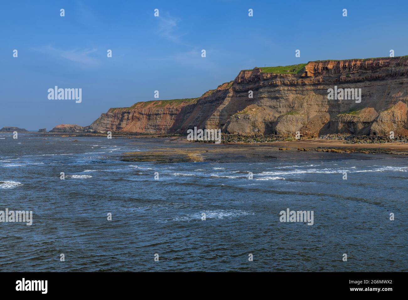 The Rugged Cliffs And Coastline Of The Classic Old fashioned British Seaside Town Of Whitby the-rugged-cliffs-and-coastline-of-the-classic-old-fashioned-british-seaside-town-of-whitby