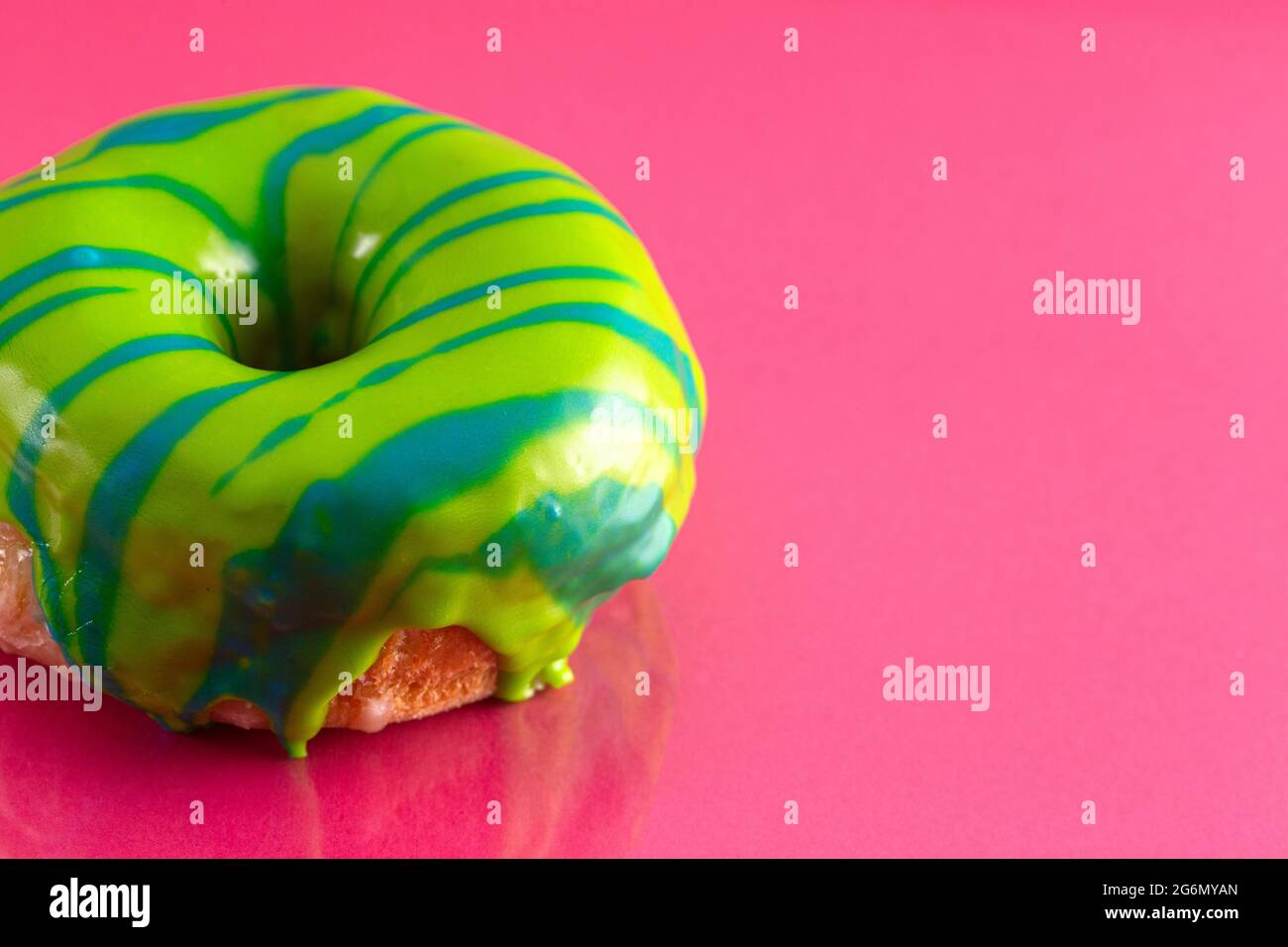 A Green and Blue Striped Glazed Donut Stock Photo - Alamy