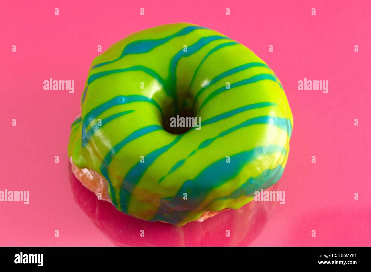 A Green and Blue Striped Glazed Donut Stock Photo - Alamy