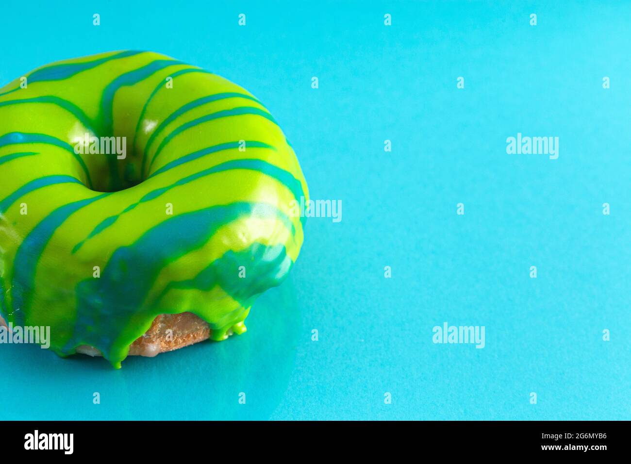 A Green and Blue Striped Glazed Donut Stock Photo - Alamy