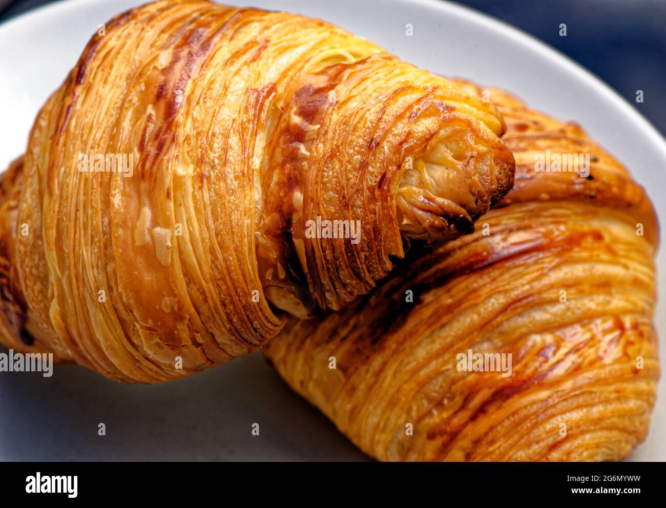 Fresh croissant, puff pastry and buttered french croissant on a plate ...
