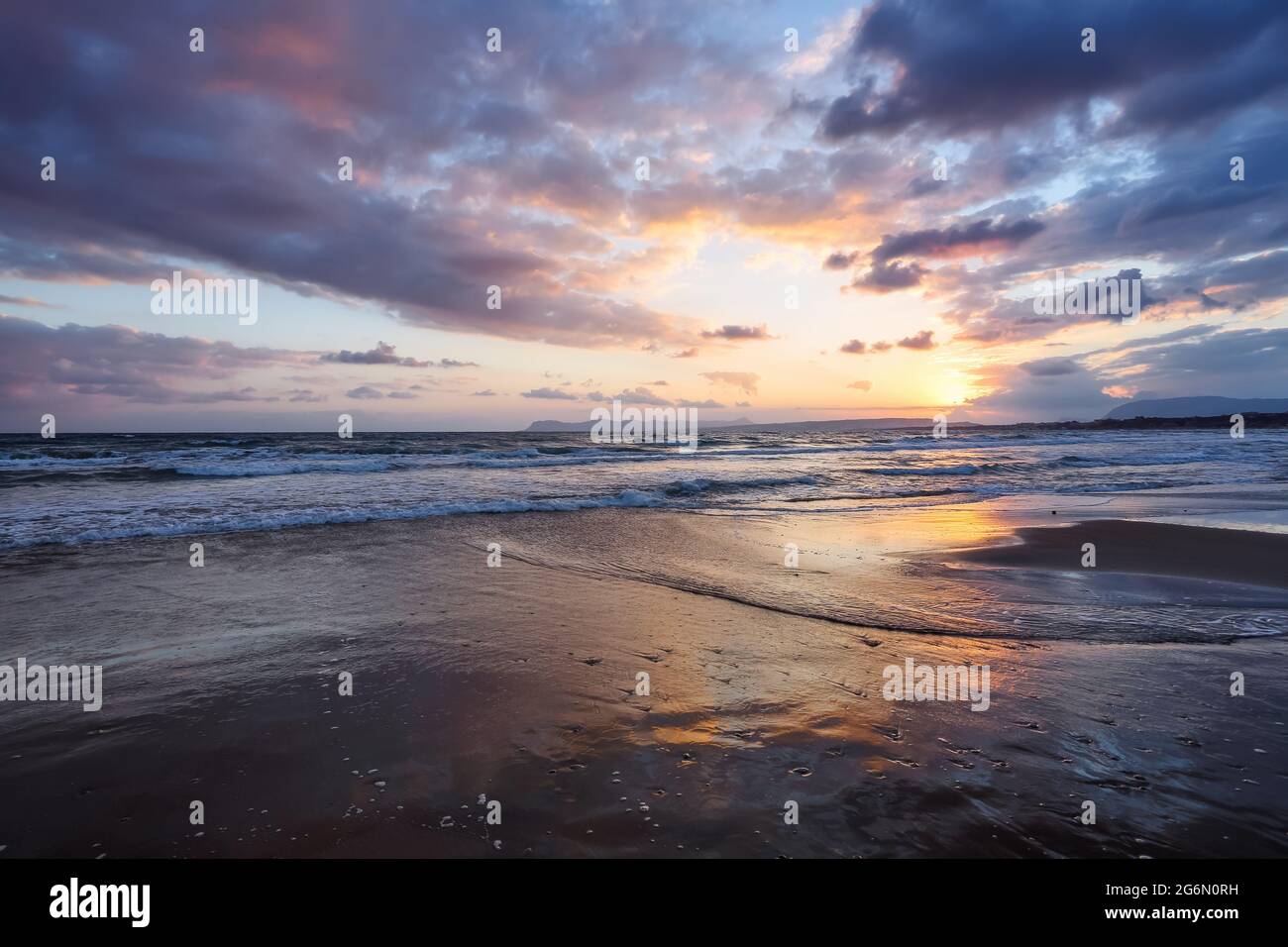 Greece, Crete. Beautiful summertime view seascape. The wet sand on the ...