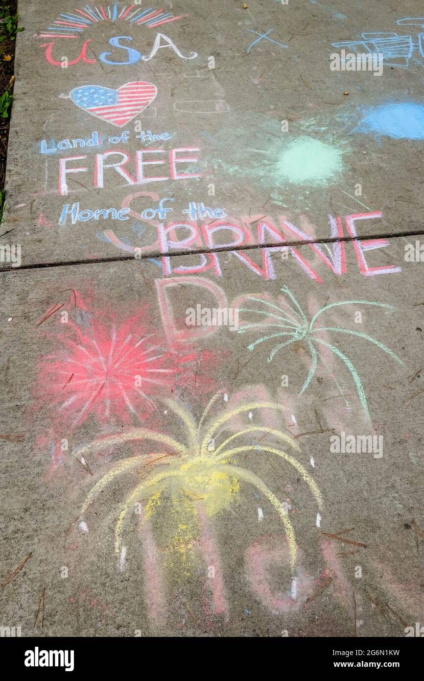 Land of the free Home of the brave. Chalk drawing on pathway,USA July ...