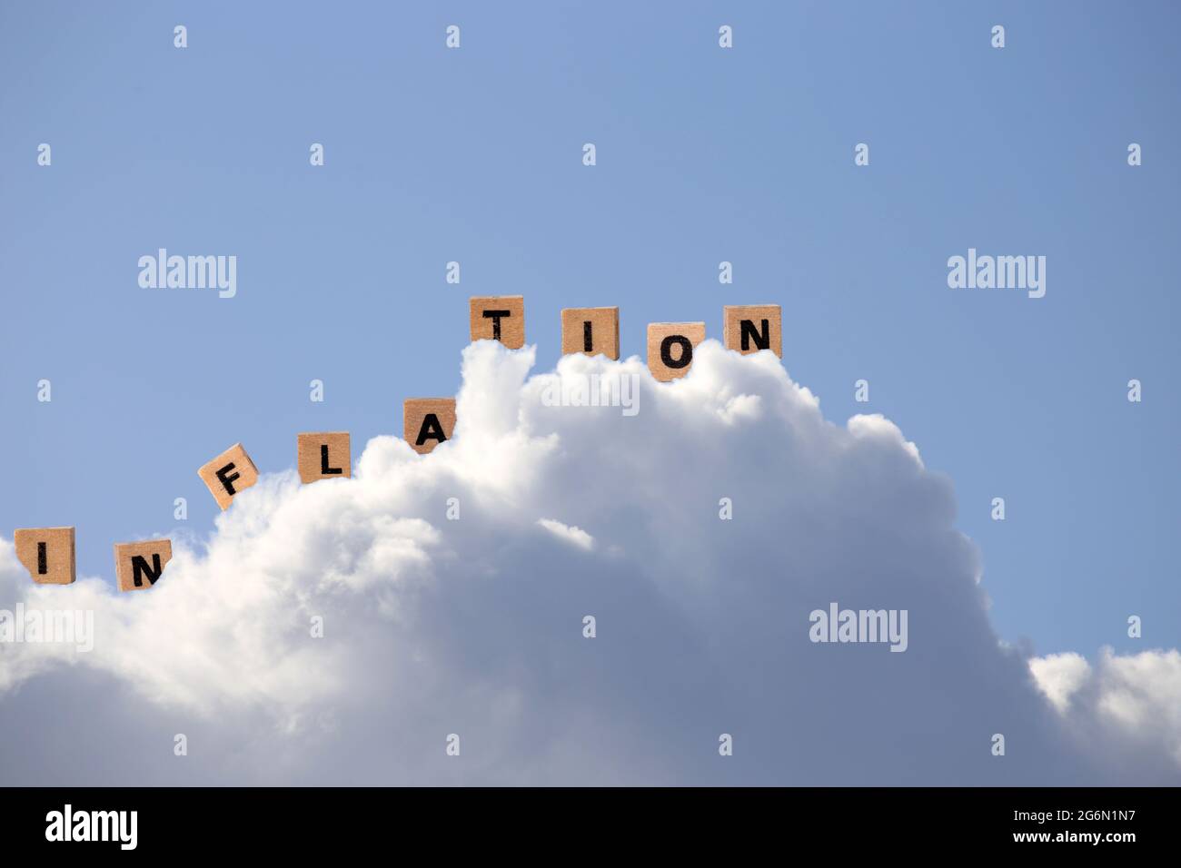 Symbol inflation Germany: Letter cube on a cloud Stock Photo - Alamy