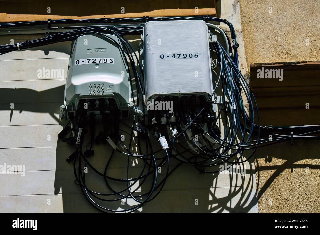 Seville Spain July 07, 2021 Electric cables on the facade of a building ...